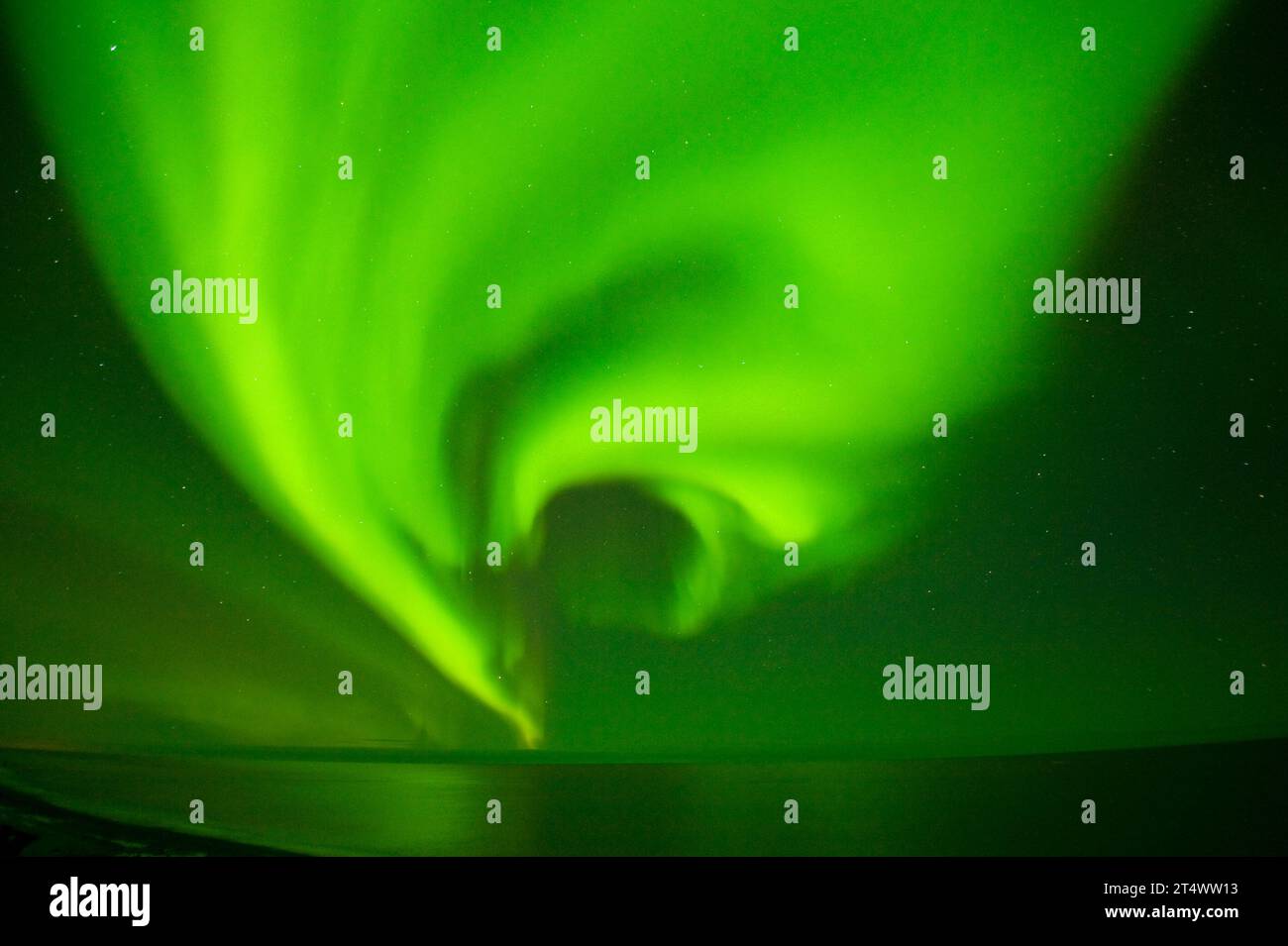 Northern lights Aurora borealis glow brightly and snake across the ...