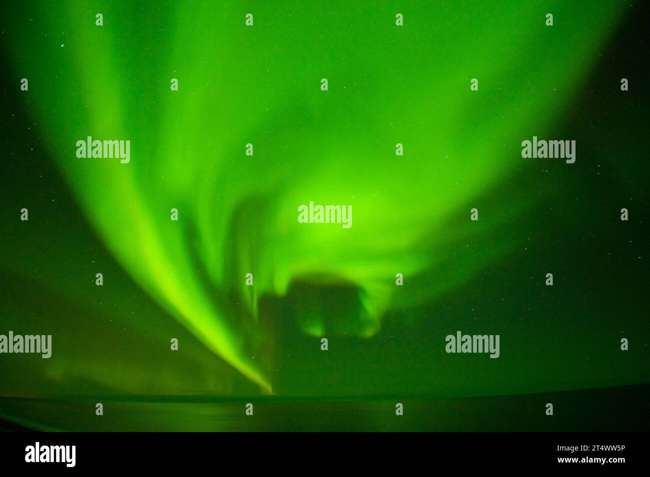 Northern lights Aurora borealis glow brightly and snake across the ...