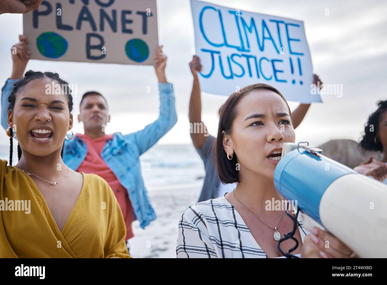 Megaphone, climate change and Asian woman protest with crowd at beach ...