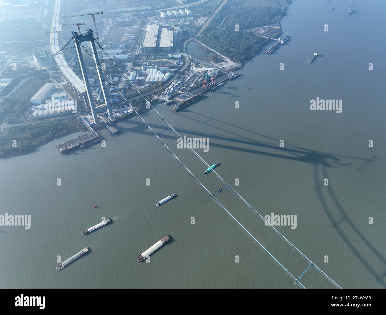 Aerial photo shows the Longtan Yangtze River Bridge under construction ...