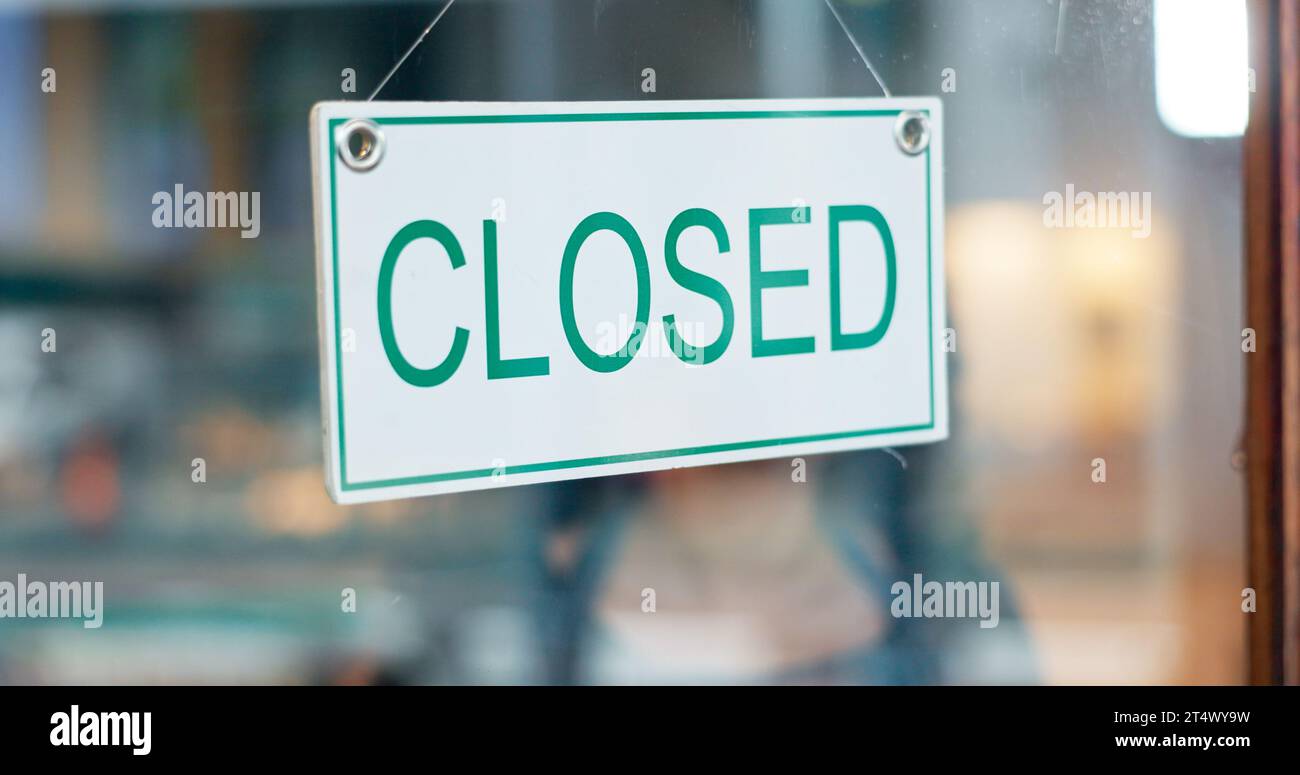 Front door, small business or closed sign on window in coffee shop or ...