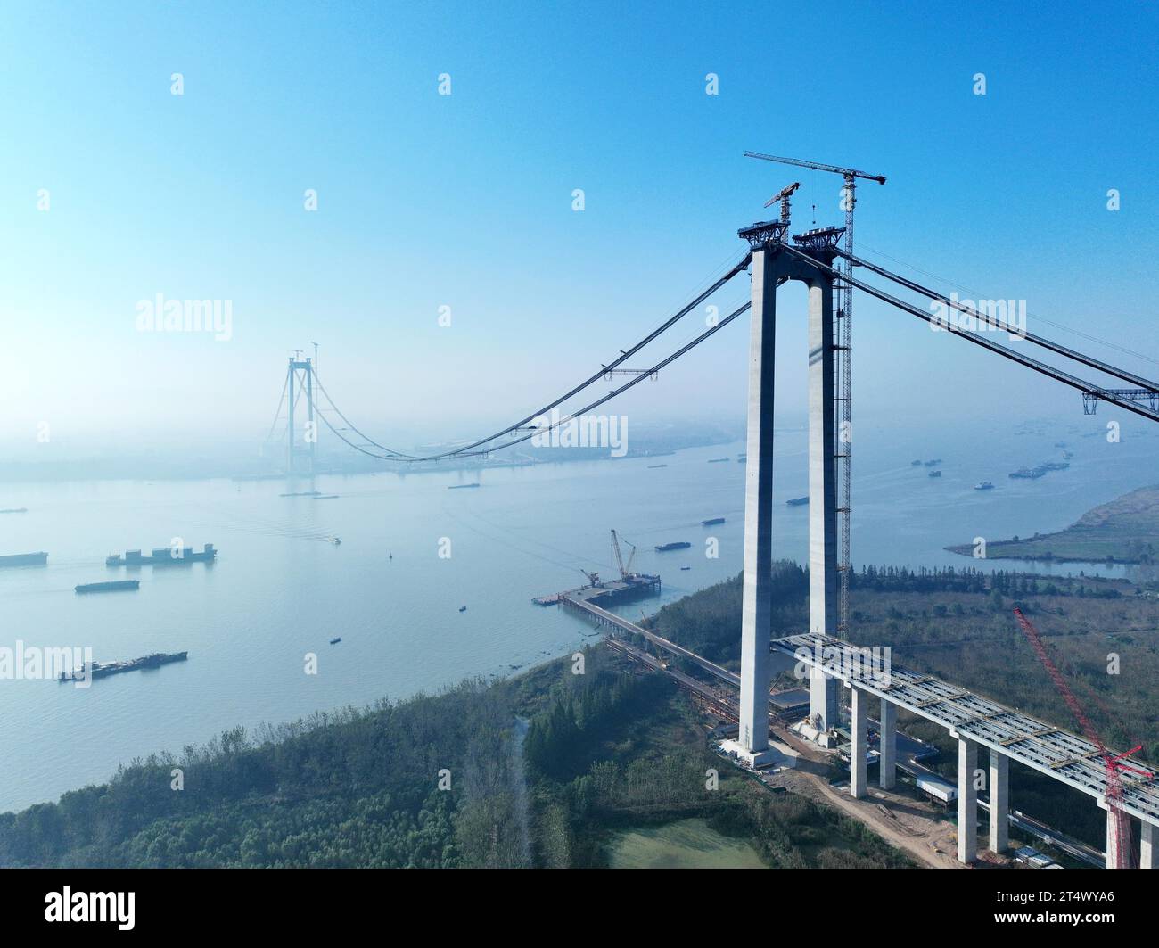 Aerial photo shows the Longtan Yangtze River Bridge under construction ...