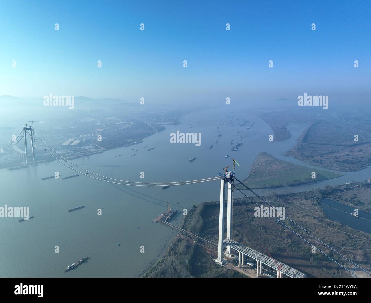 Aerial photo shows the Longtan Yangtze River Bridge under construction ...