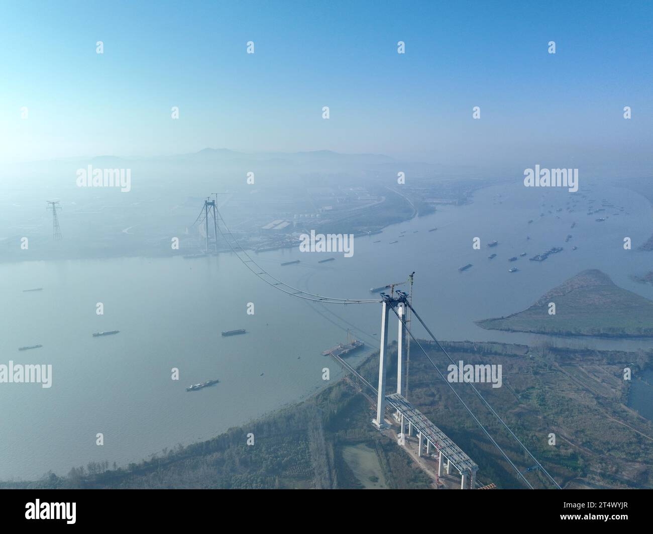 Aerial photo shows the Longtan Yangtze River Bridge under construction ...