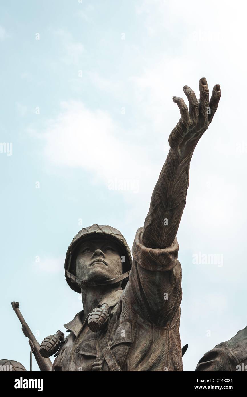 A bronze statue depicting a proud army officer with four loyal soldiers ...