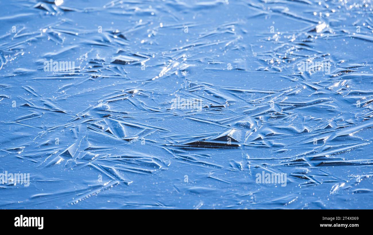 Thin ice crystals, frozen water surface, natural background photo with ...