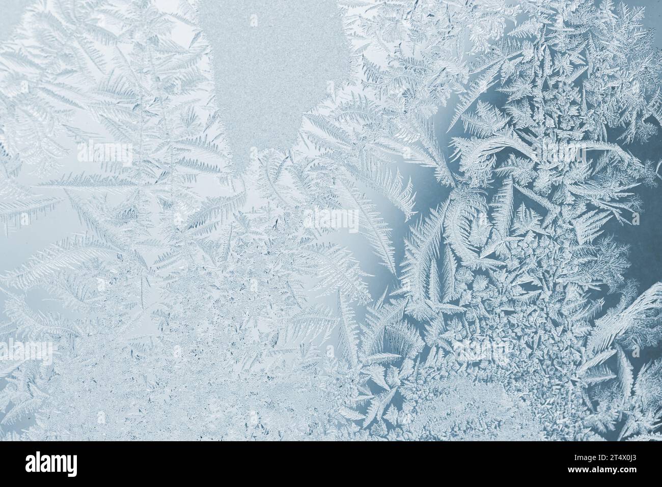 Natural patterns of a frost on a window glass, macro photo, blue winter ...