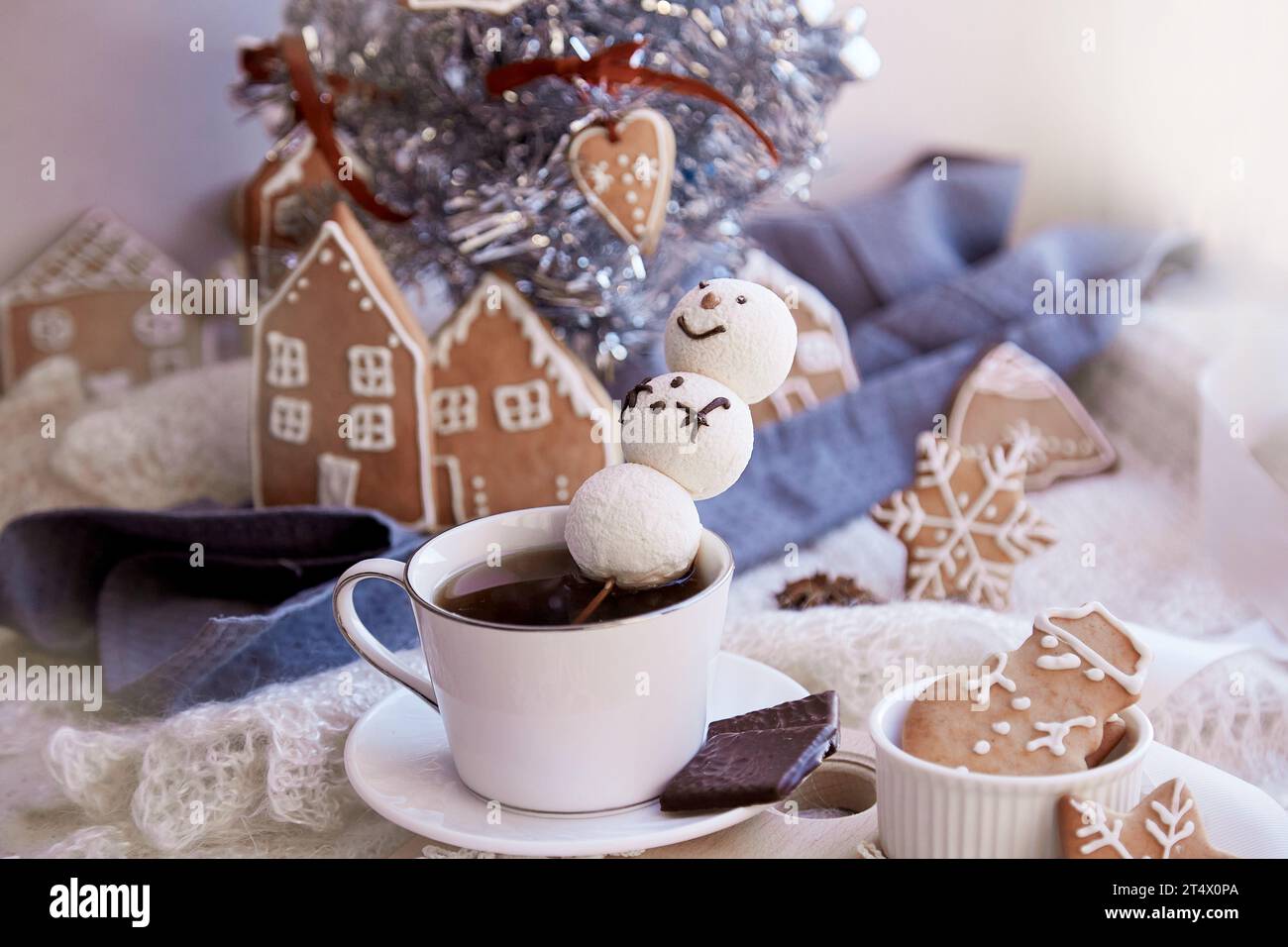 Winter aesthetic morning. Marshmallow snowman in hot chocolate, ginger ...