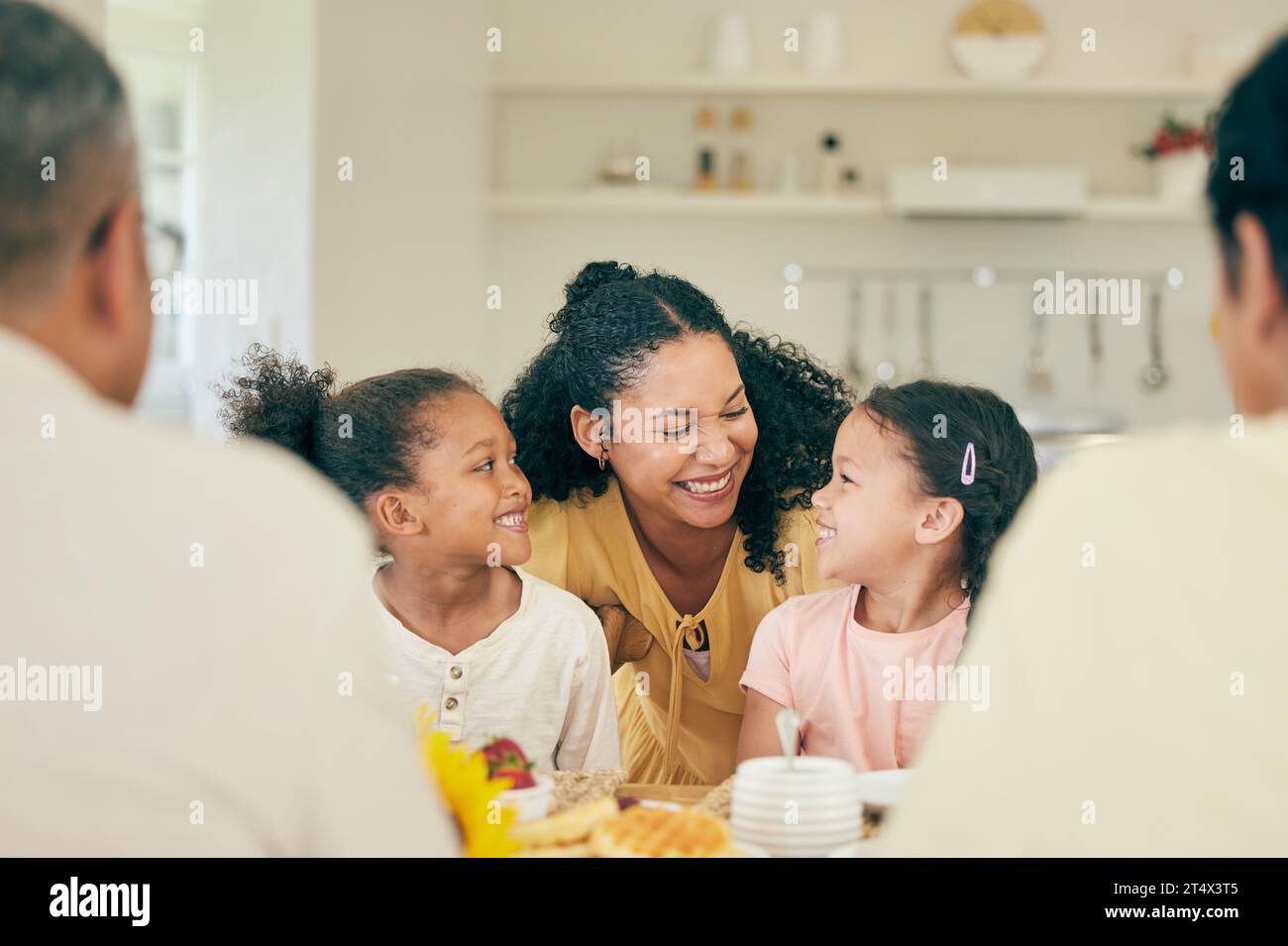 Birthday, mother and children at table for lunch, dinner and meal ...