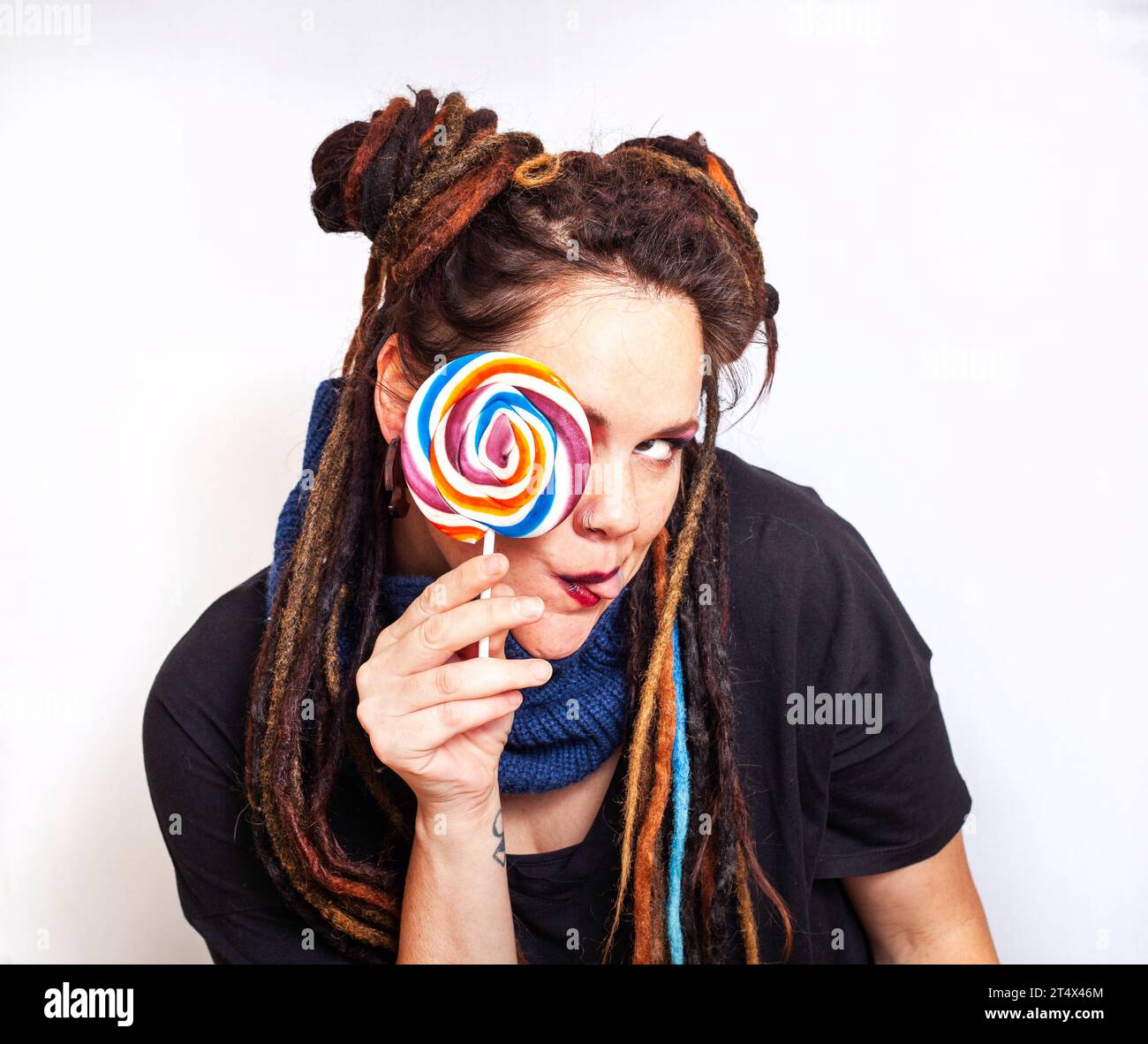 Alternative dreadlocked Caucasian woman with colorful and playful ...