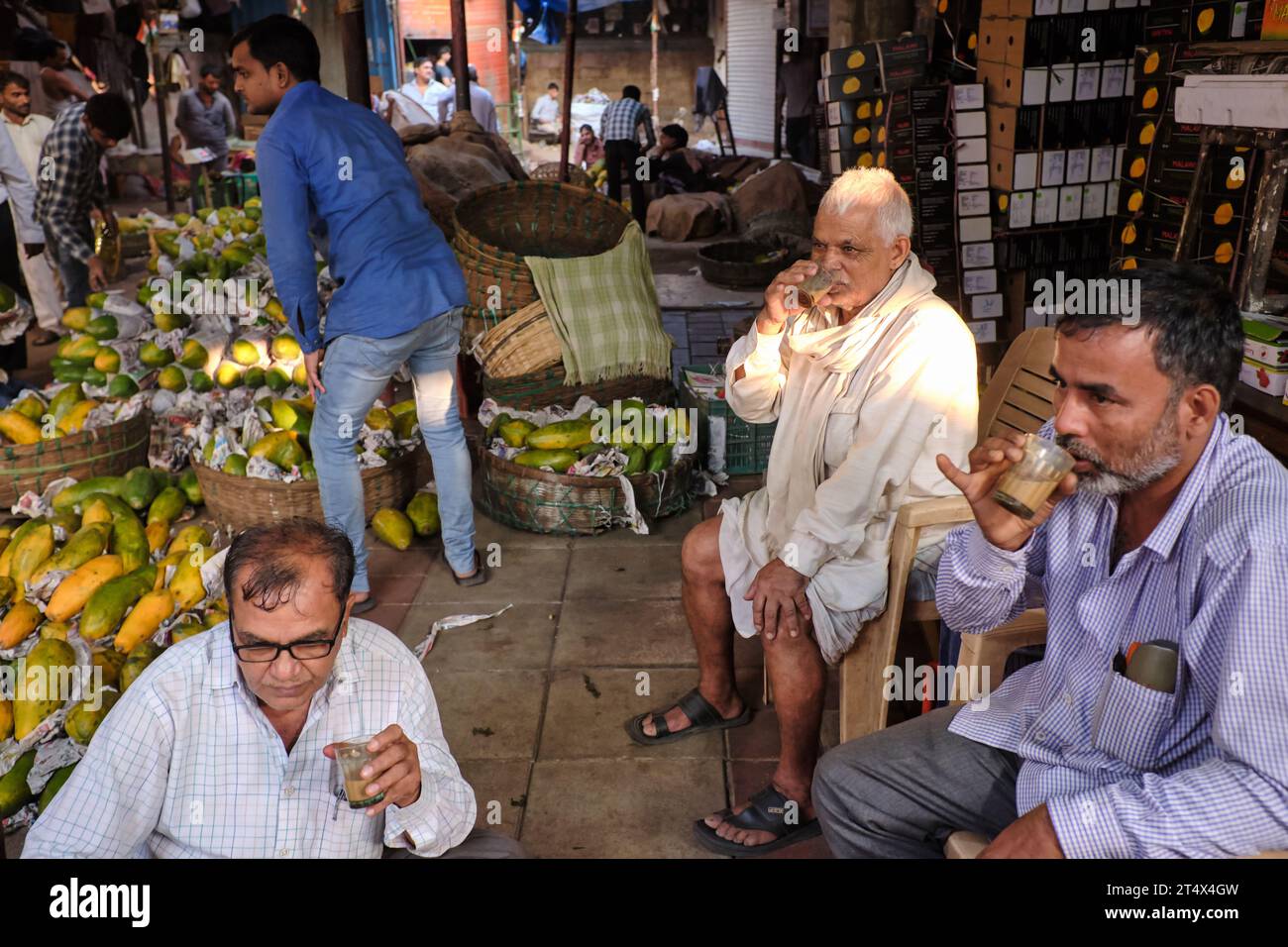 Indian men working at Crawford Market in Mumbai, India, having a tea ...