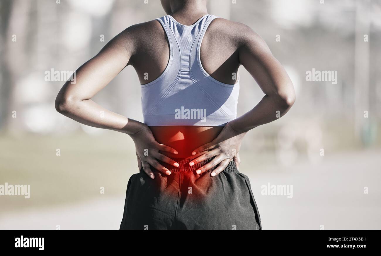 Runner woman, back pain and street with hands, emergency and problem ...