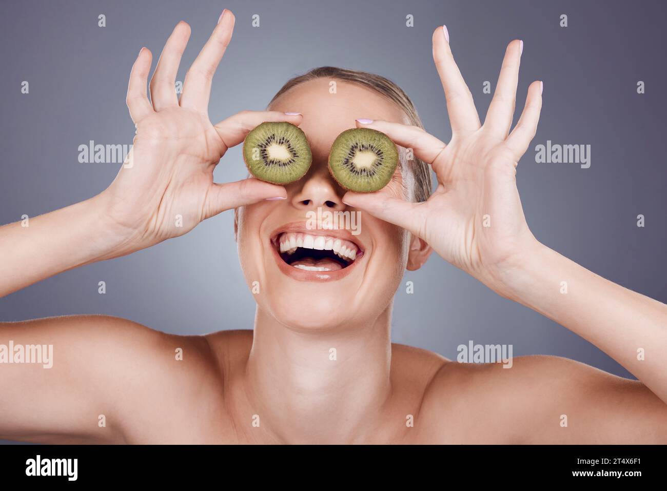 Kiwi, woman and cover eyes for beauty, skincare and wellness food on ...
