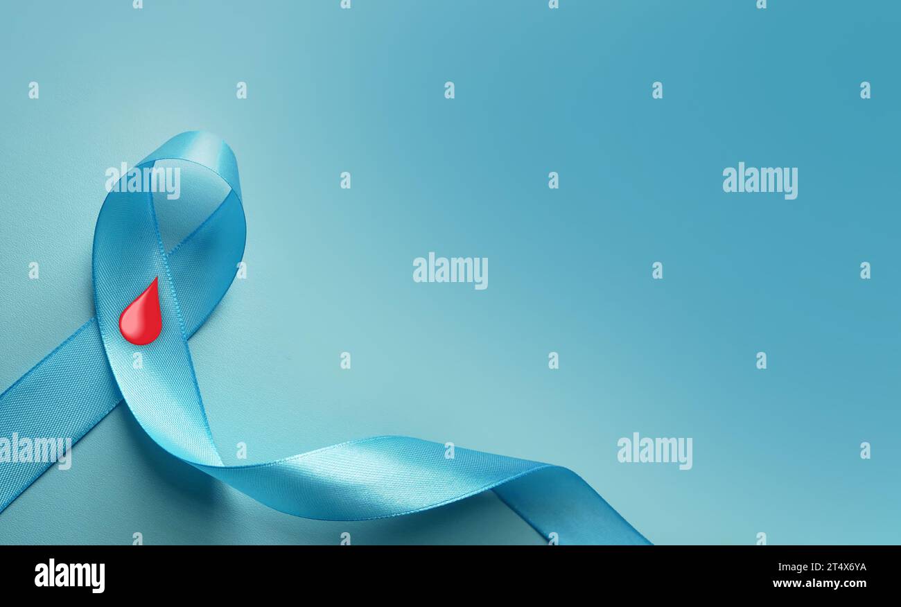 World diabetes day awareness concept. Blue ribbon with blood drops on a ...