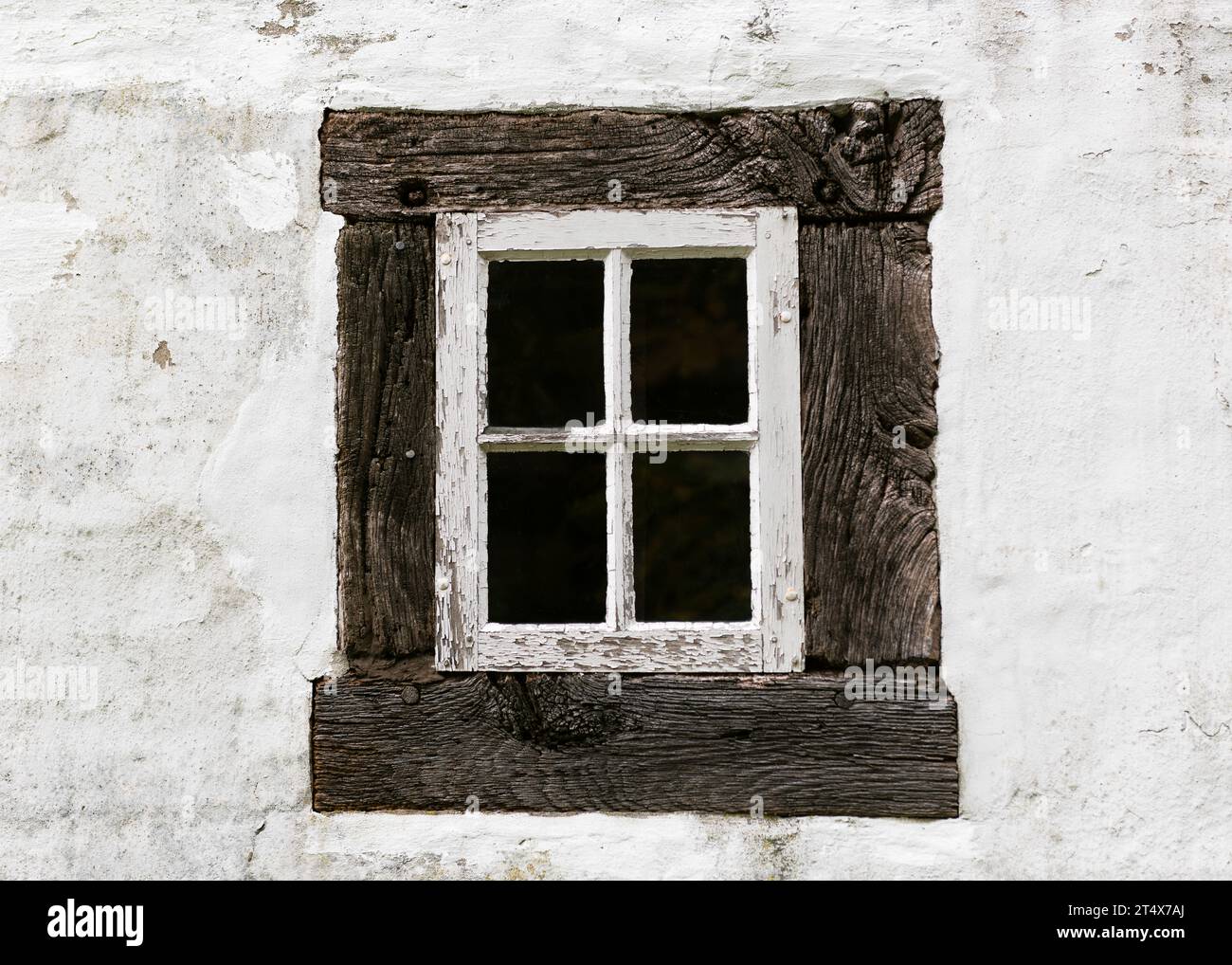 Antique old residential window frame on a white background with panes ...