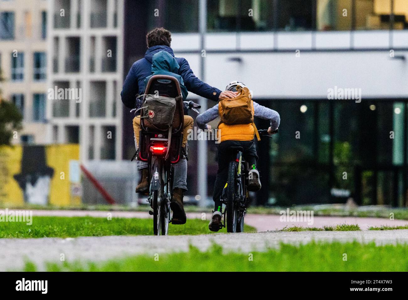 ROTTERDAM - Cyclists brave wind and rain during storm Ciaran. In a ...