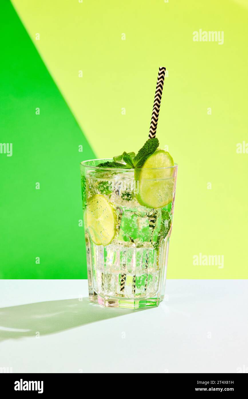 Poster. Lively lemonade with lime slices showcased against vibrant ...