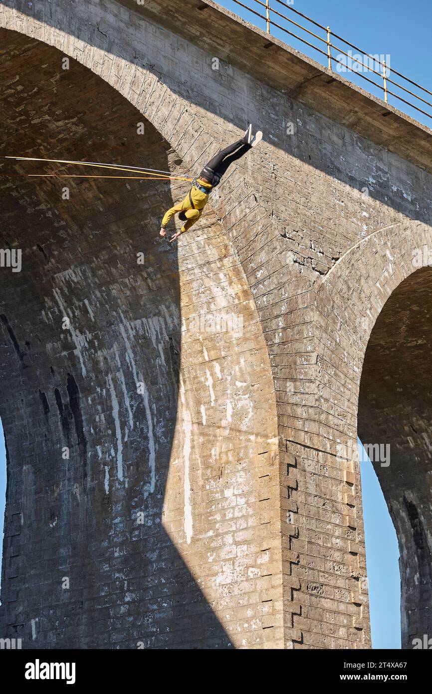 Bungee jumping from a bridge. Extreme sports. Adrenaline. Excitement ...
