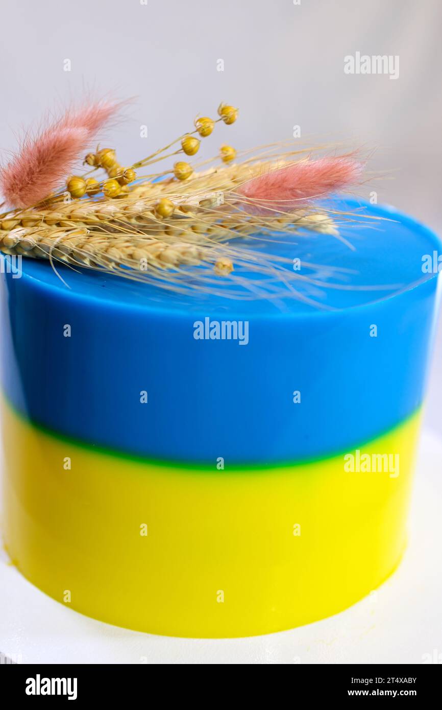delicious sponge cake with yellow and blue dye spikelets of wheat and ...
