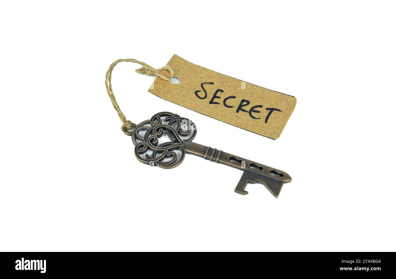 Antique old key with secret tag on white background Stock Photo - Alamy