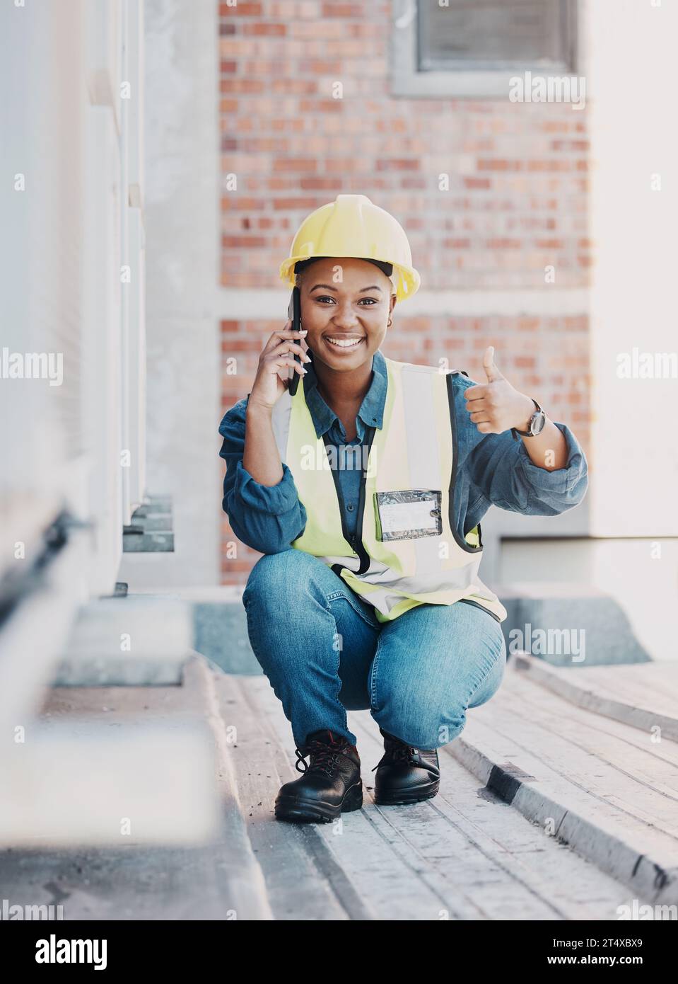 Phone call, portrait black woman, construction worker and thumbs up for ...