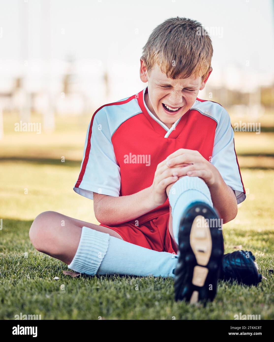 Soccer, knee injury and pain on a field after match, training or ...