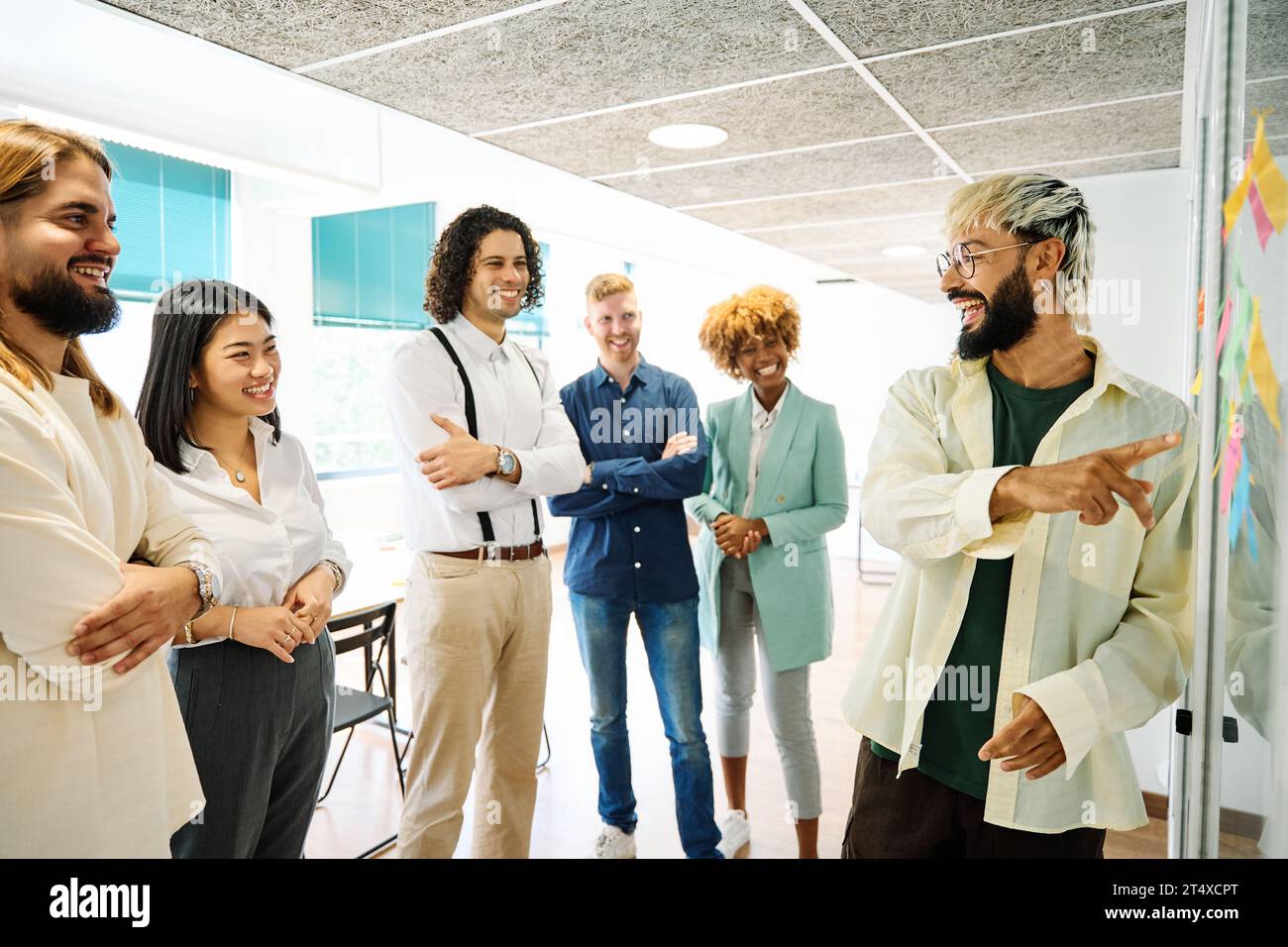 Happy man during a brainstorming using post-its Stock Photo - Alamy