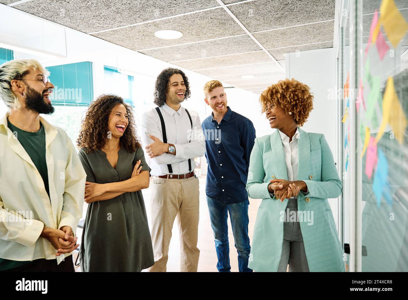 African woman presenting ideas using post-its on a coworking Stock ...