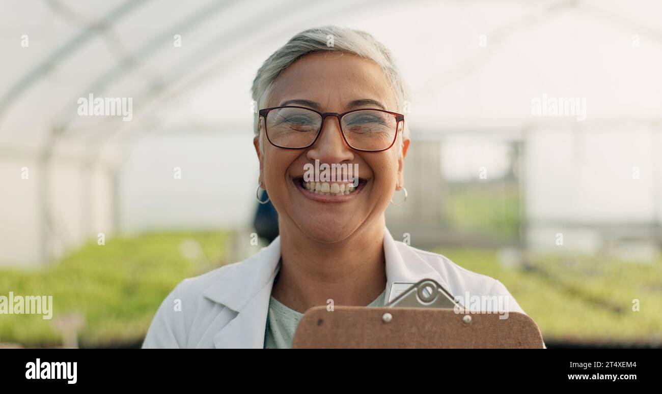 Portrait, botanist and happy woman at greenhouse for science at farm ...
