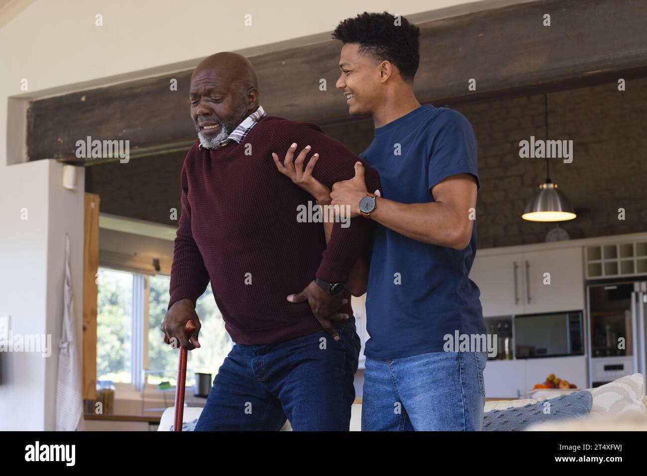 Father helping son stand hi-res stock photography and images - Alamy