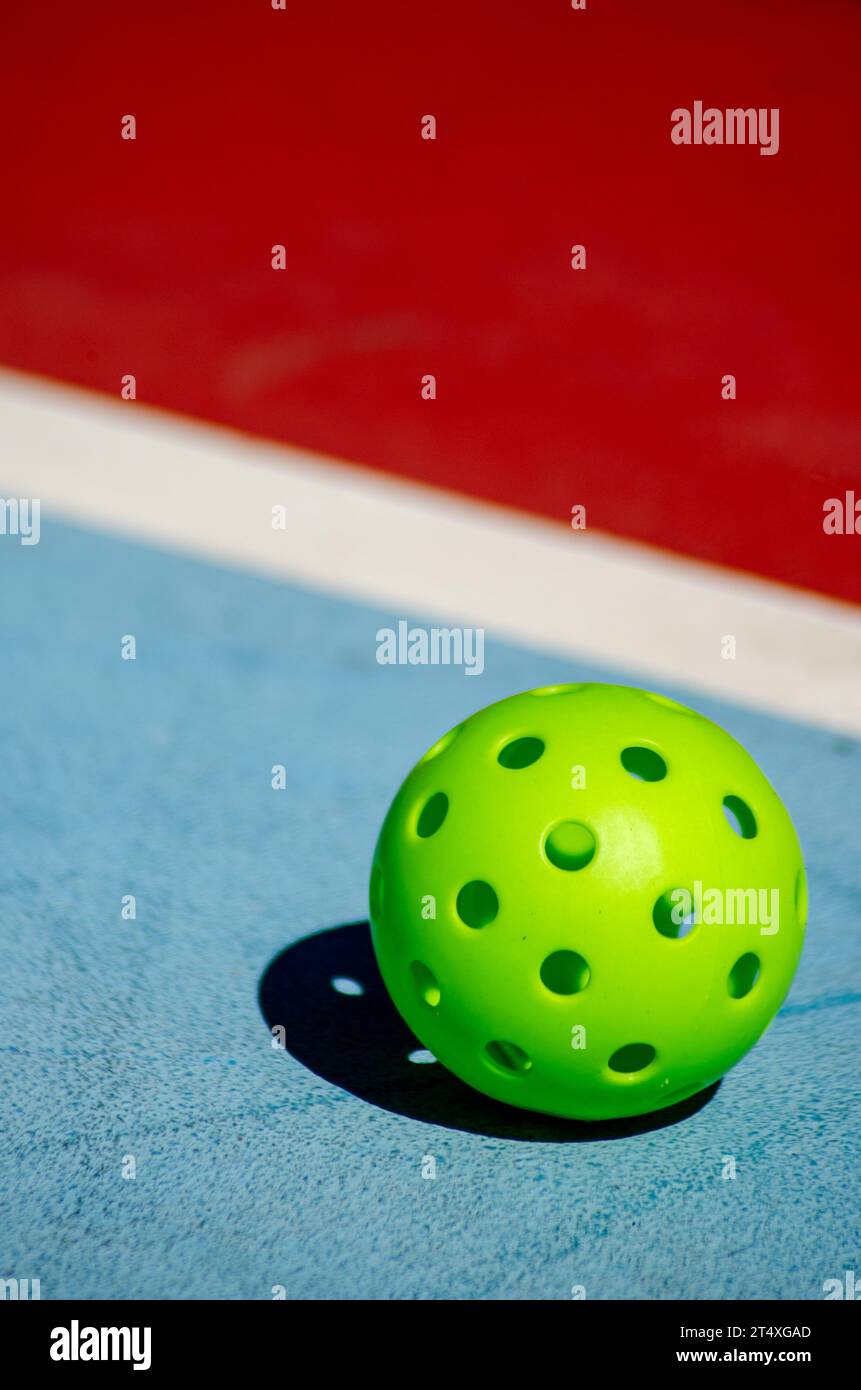 Close up of a pickleball on pickleball blue and red court Stock Photo ...