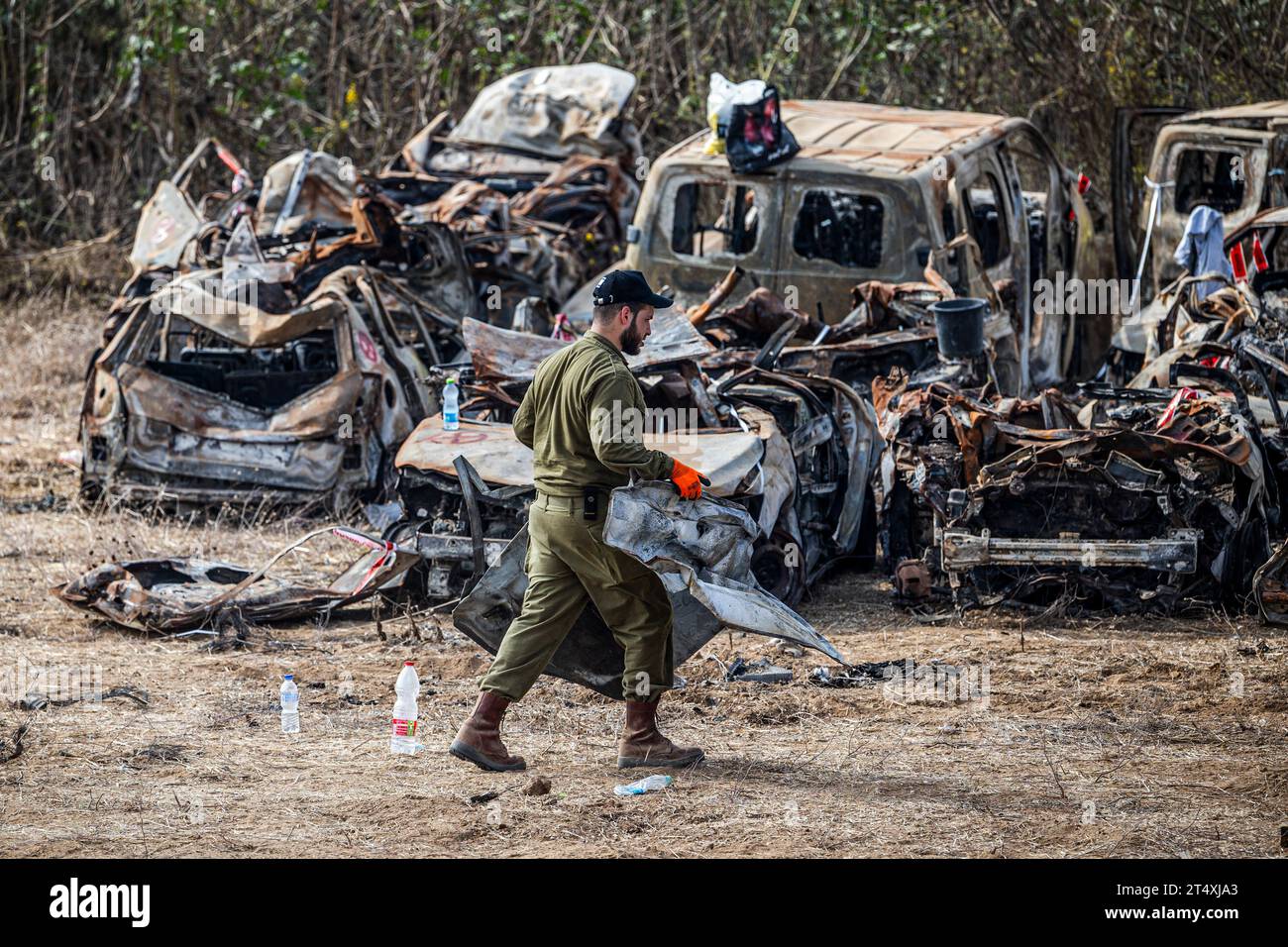 Netivot, Israel. 02nd Nov, 2023. An Israeli army soldier inspects some ...