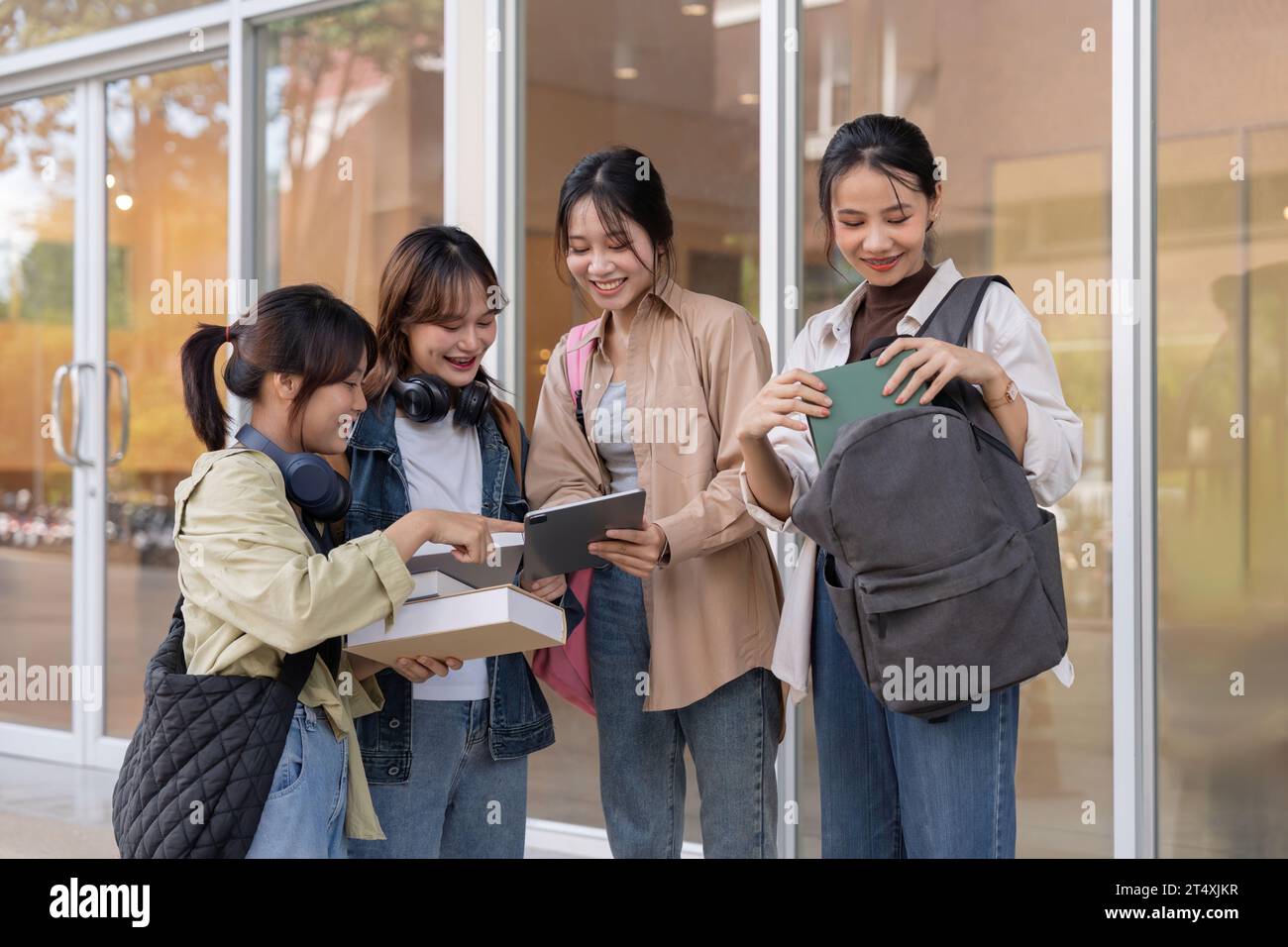 Happy young student chat with each other after class. Guy and girls ...