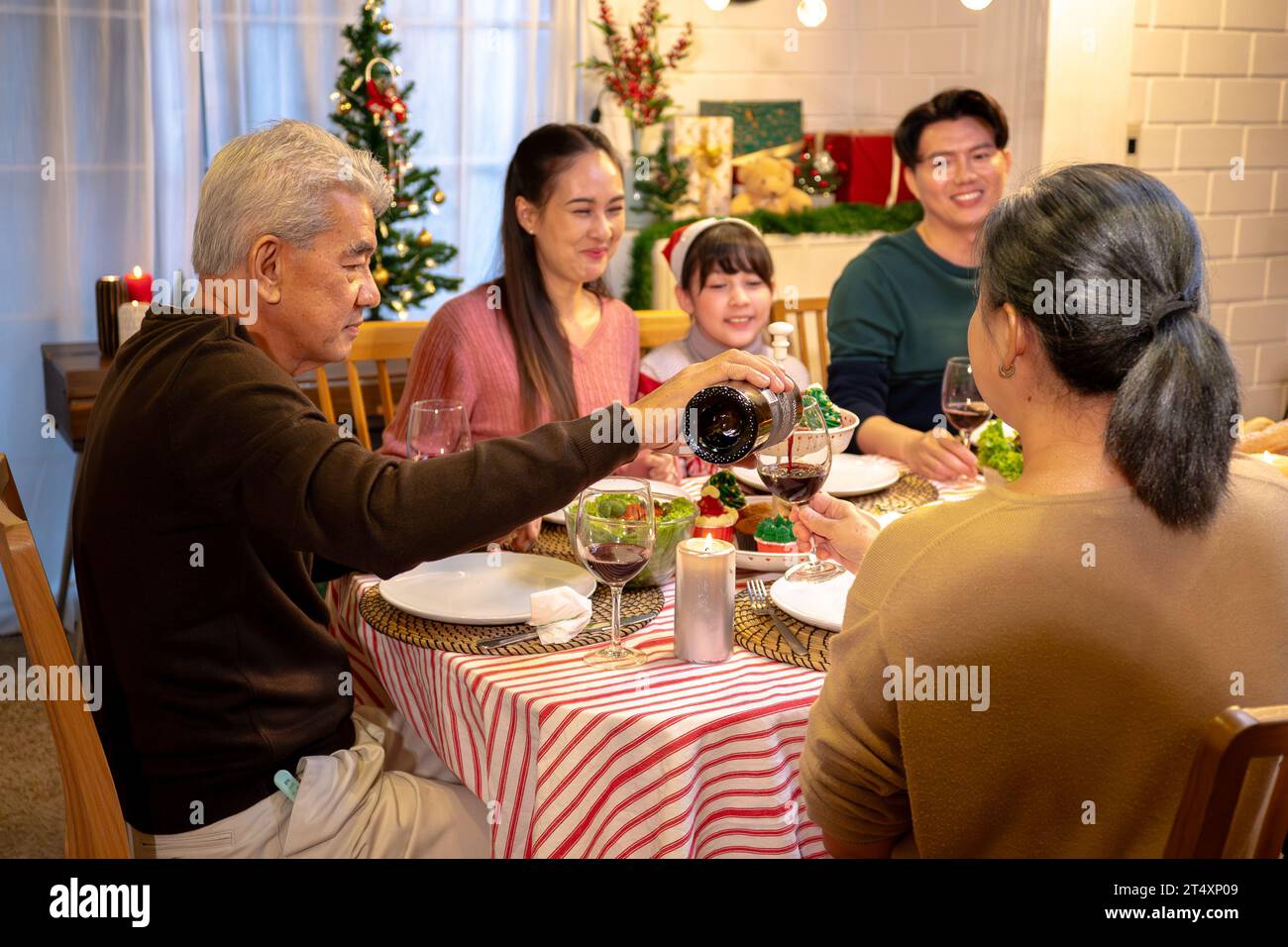 Happy people are celebrating on a table meal when christmas and new ...