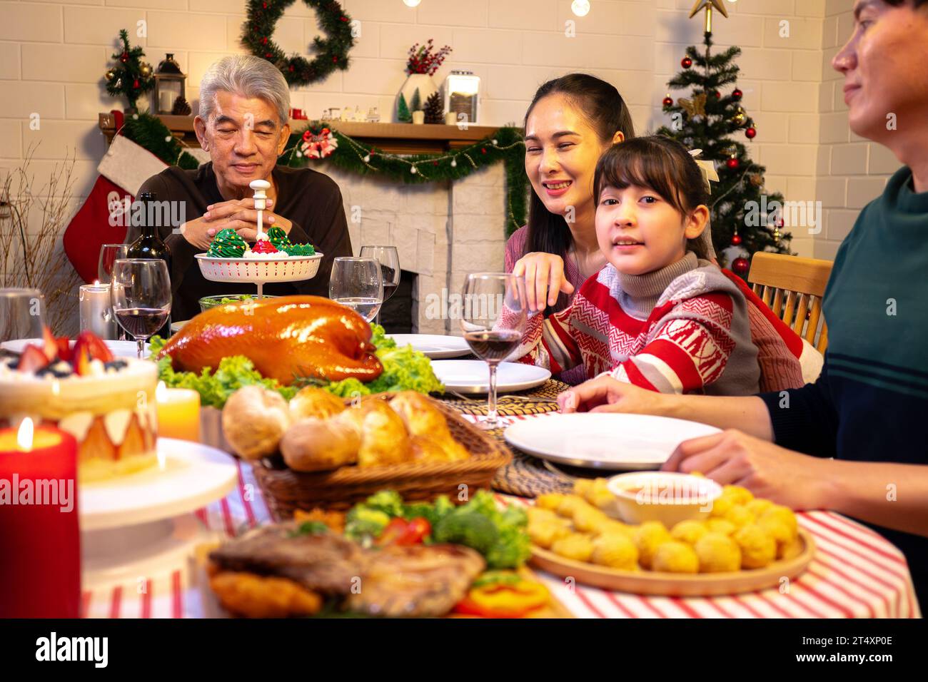 Happy people are celebrating on a table meal when christmas and new ...