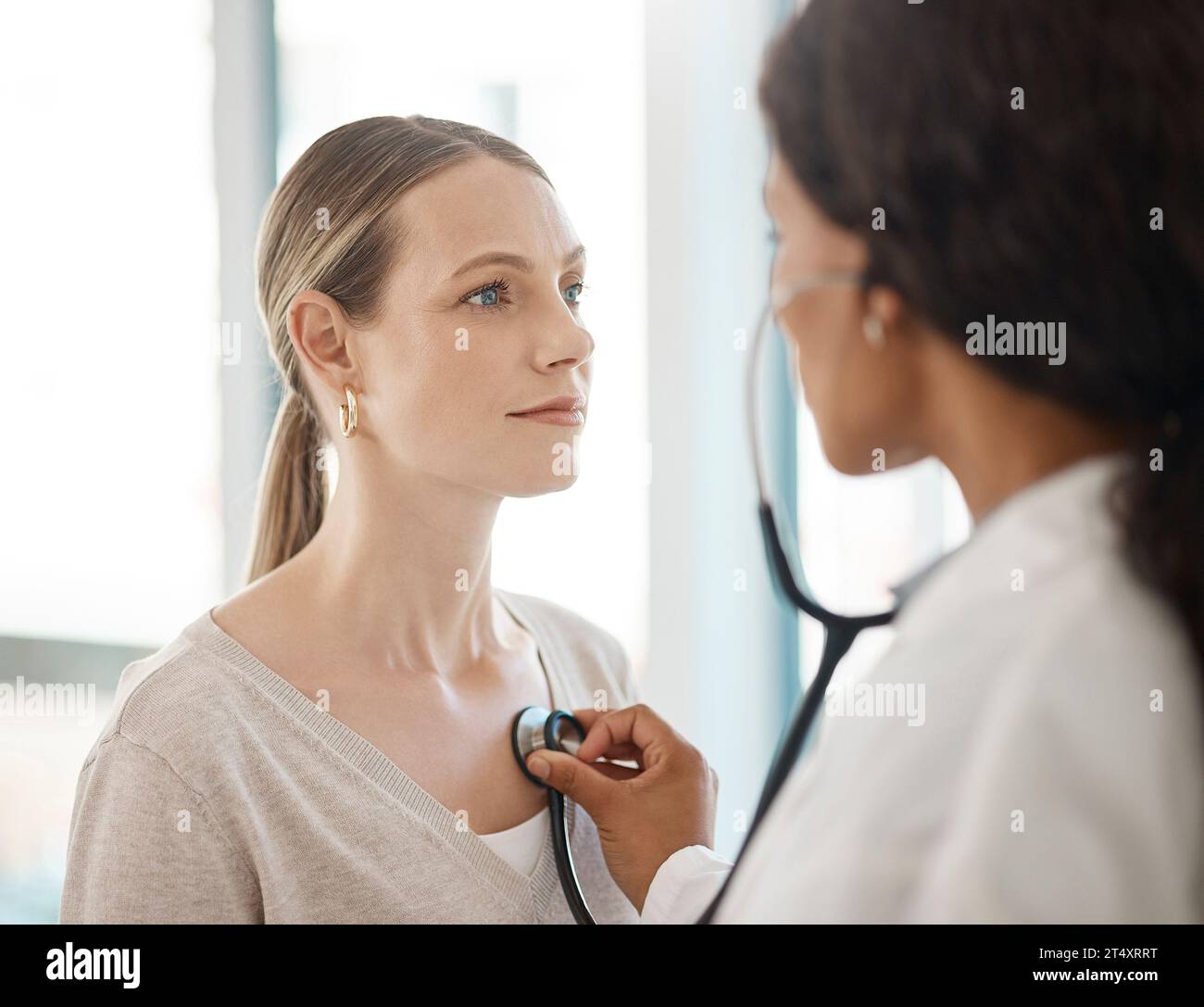 Doctor listening to stethoscope heartbeat, patient breathing and lungs ...