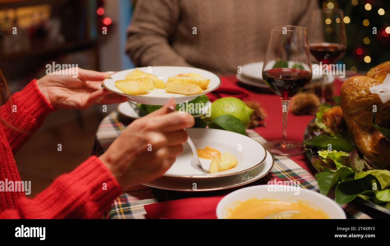 Family sharing dishes during thanksgiving dinner Stock Photo - Alamy