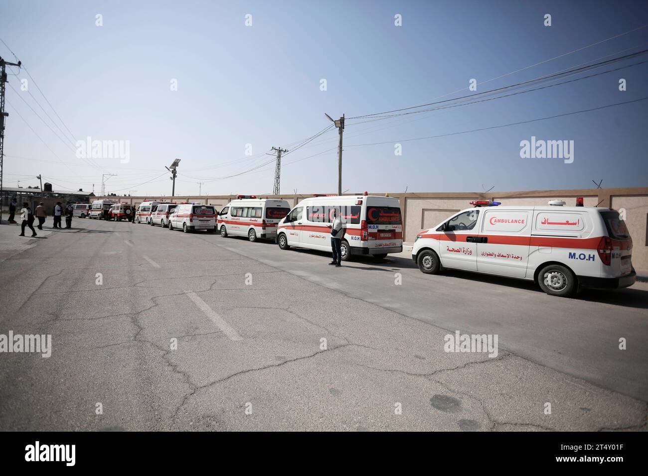 Palestinian health ministry ambulances arrive outside the Rafah border ...