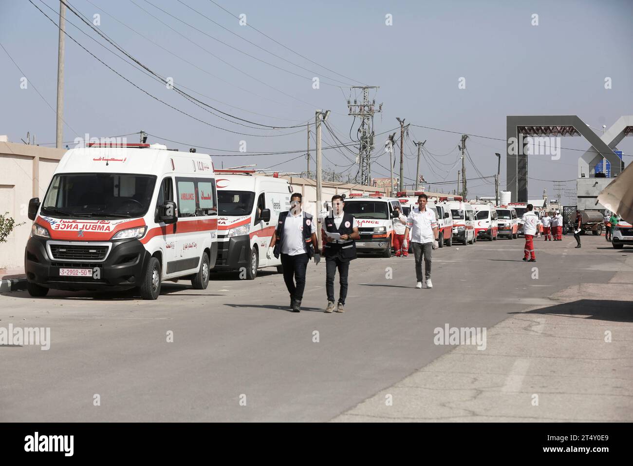 Palestinian health ministry ambulances arrive outside the Rafah border ...