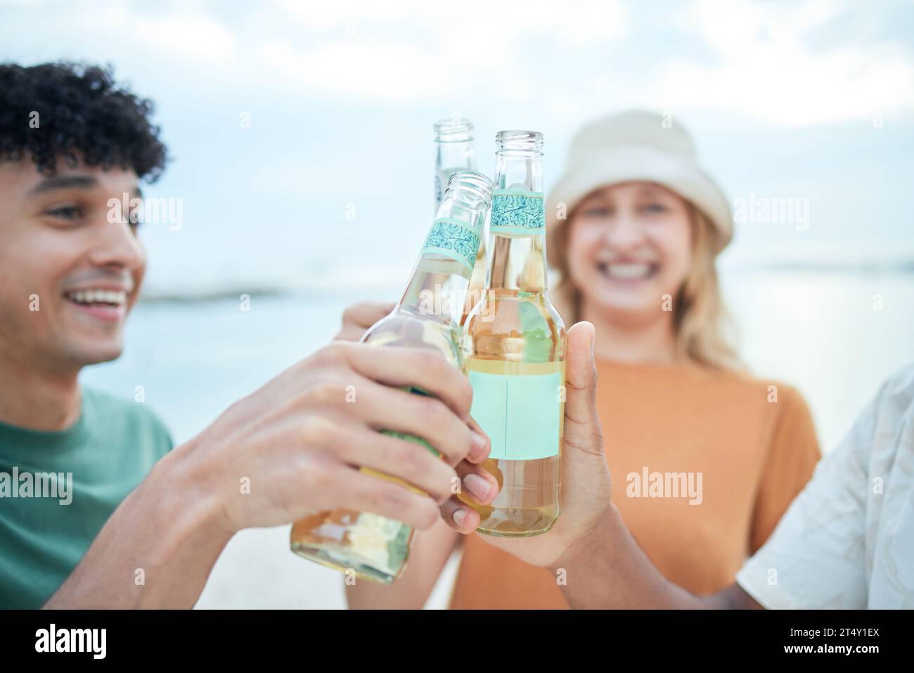 Beer, toast and friends in celebration at the beach for holiday, summer ...