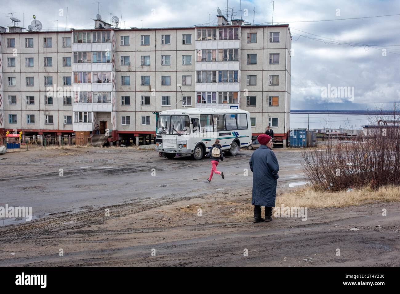 School bus stops in a housing estate, Chersky, Yakutia, Russia Stock ...