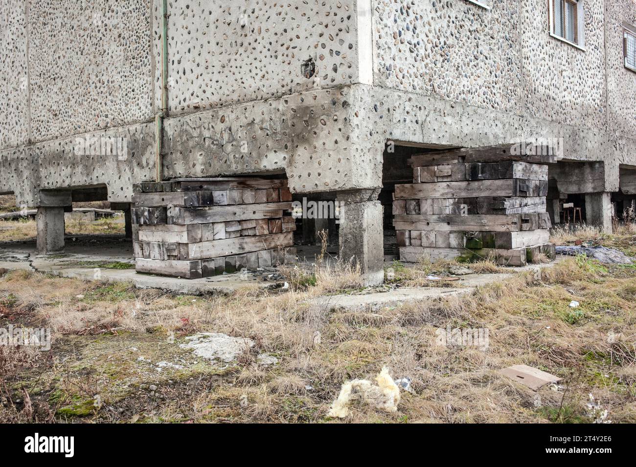 Pallets support a residential building that is in danger of sinking due ...