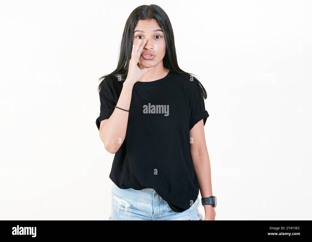 Girl whispering to the camera, isolated. Young woman whispering a promo ...