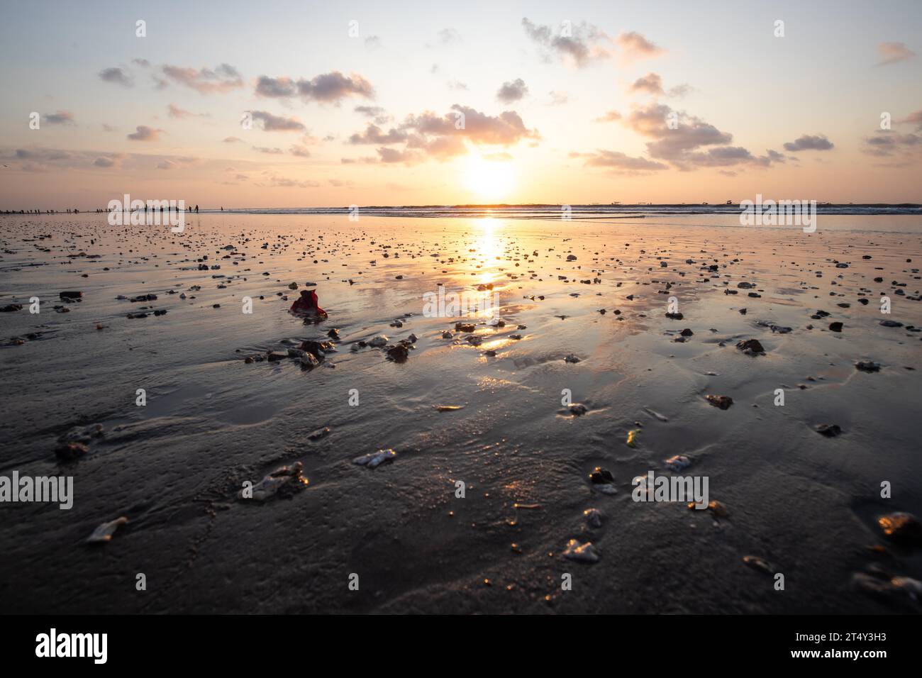 Fantastic sunset at the dream beach of Kuta, small wave set over the ...