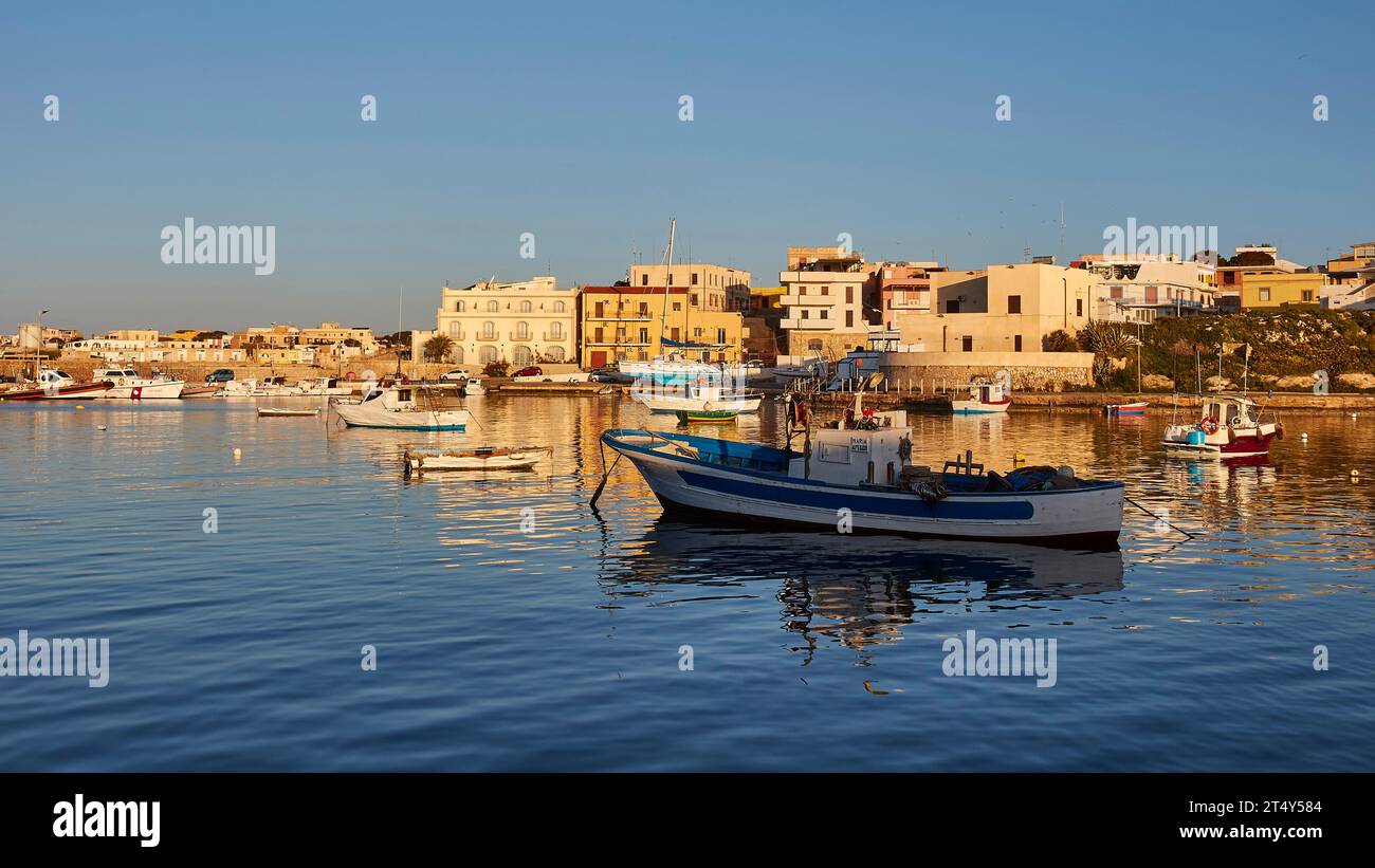 Boats, colourful houses, palm trees, Lampedusa Town, Lampedusa Island ...