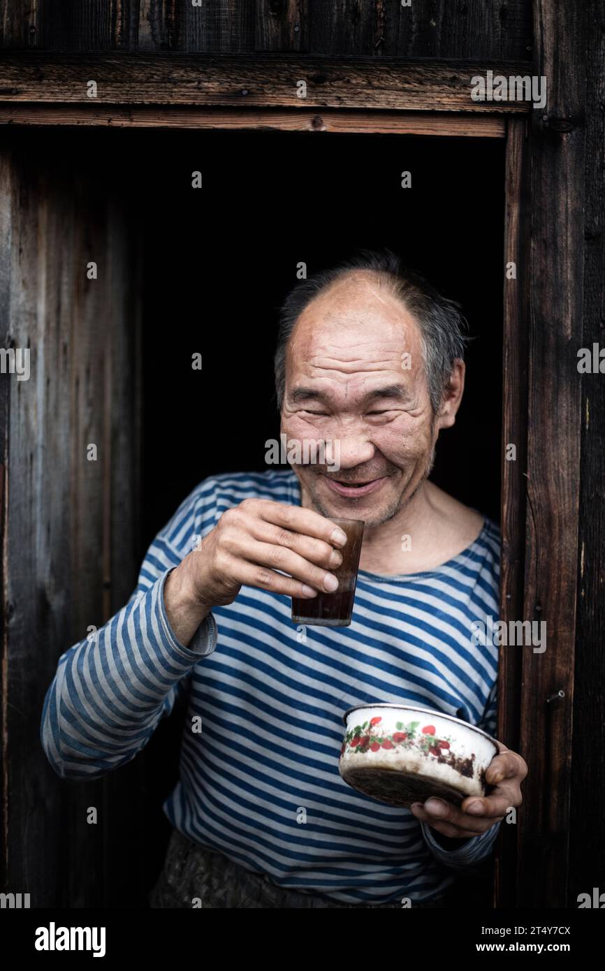 Hermit in front of his hut, Duwanni Jar, Yakutia, Russia Stock Photo ...
