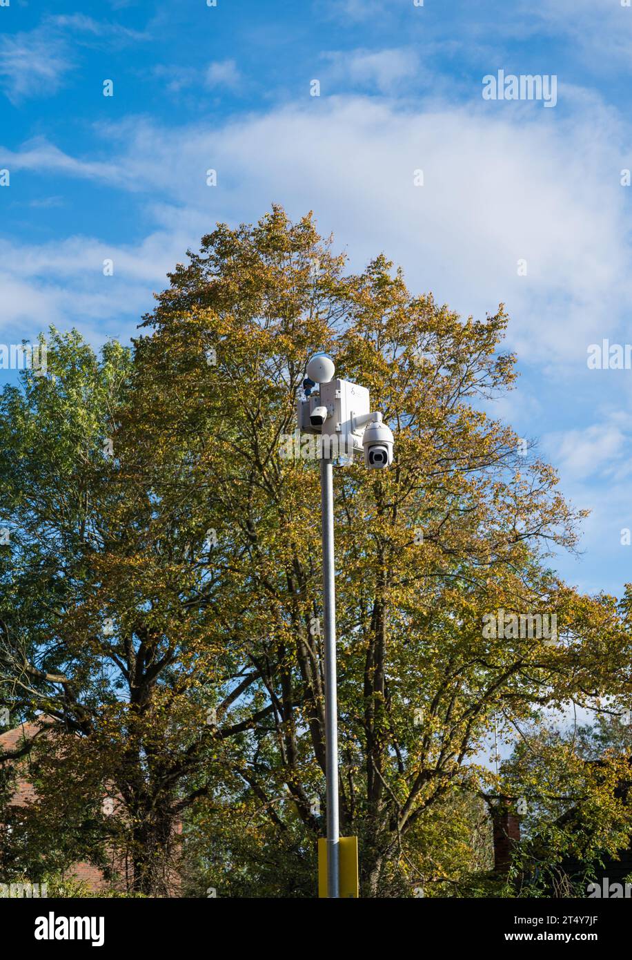 Local authority CCTV street surveillance cameras mounted at height on ...