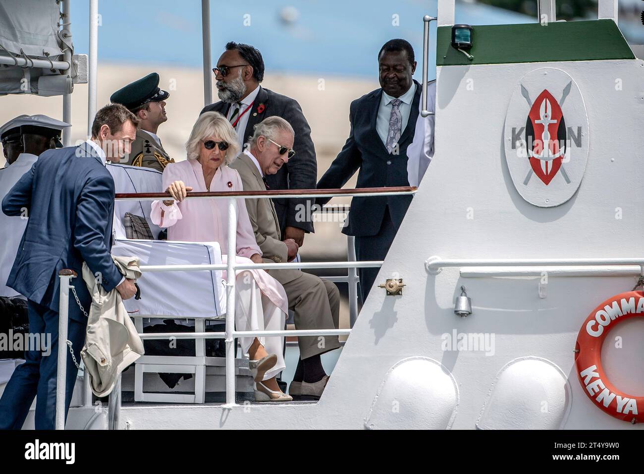 Britain's King Charles III, center, and Queen Camilla arrive aboard the ...