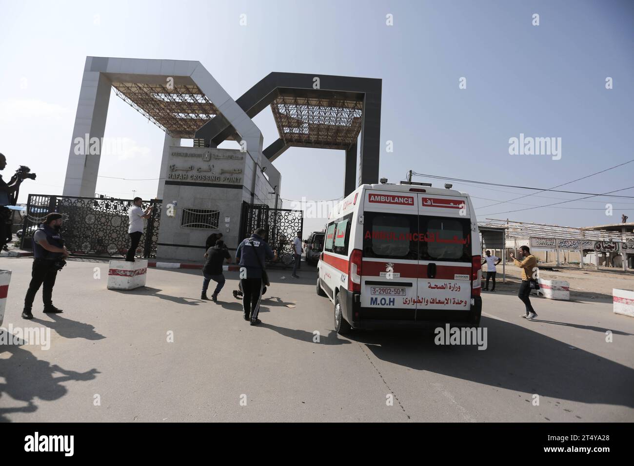 Palestinian health ministry ambulances arrive outside the Rafah border ...