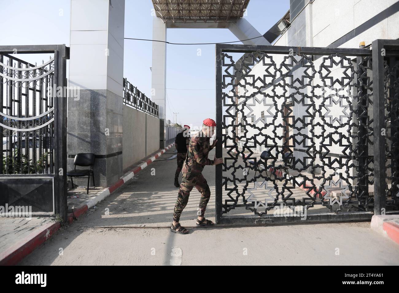 People walk through a gate to enter the Rafah border crossing to Egypt ...